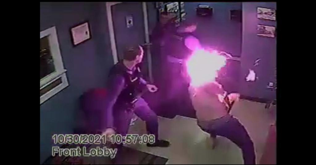 Watch man burst into flames after being hit with cop's Taser